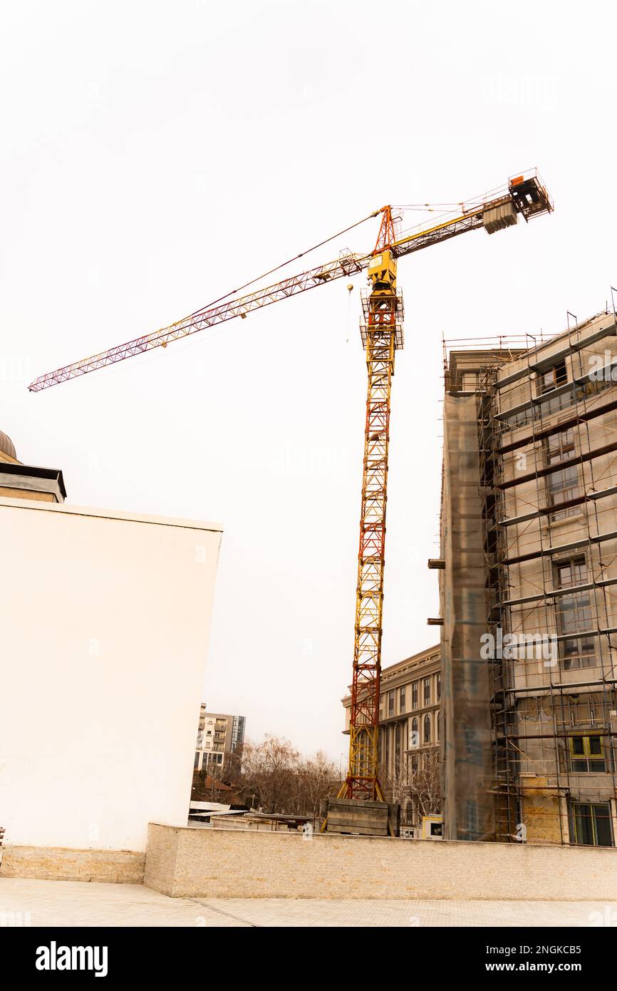 Amazing and strong big yellow crane is standing on the construction ...