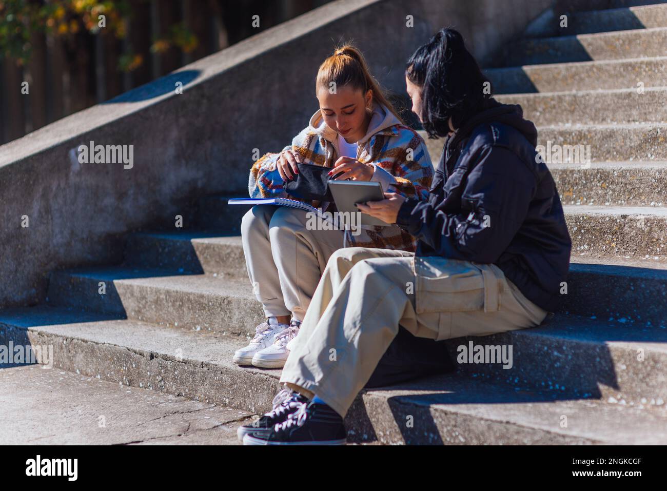 Beautiful female students finished their homework right after school ...