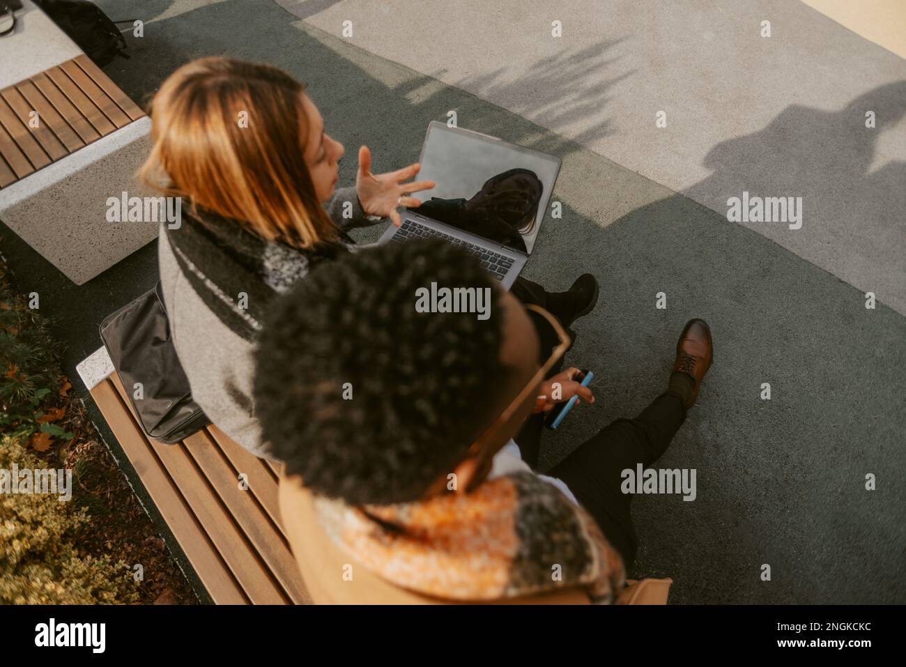 Close up of blonde business woman explaining something to her colleague ...