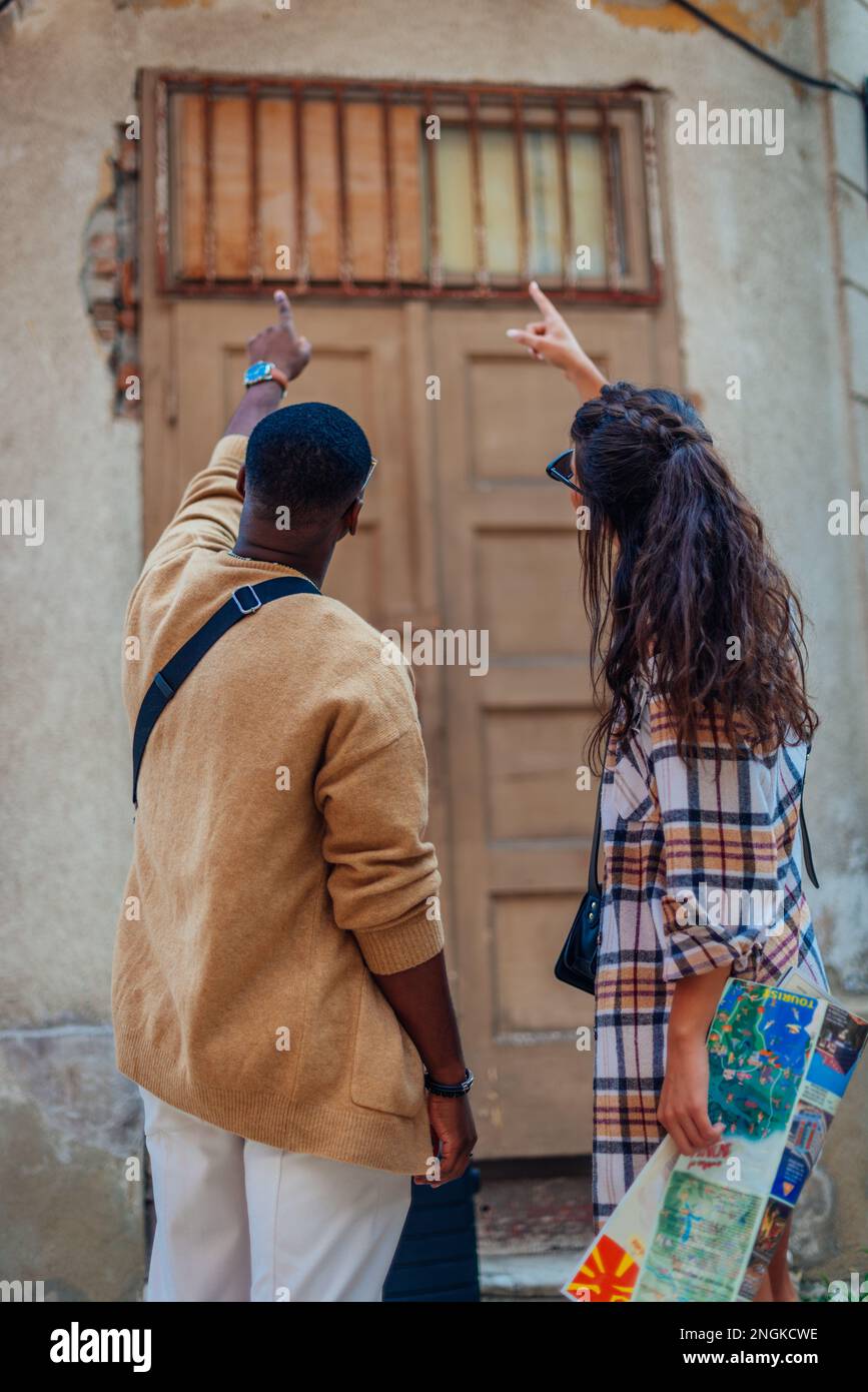 A man is trying to explain something to his girlfriend. They are ...