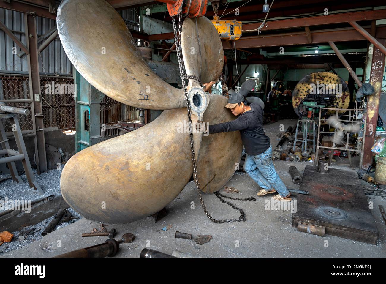 Workers repair propellers for fishing boats in Rach Gia City, Kien ...