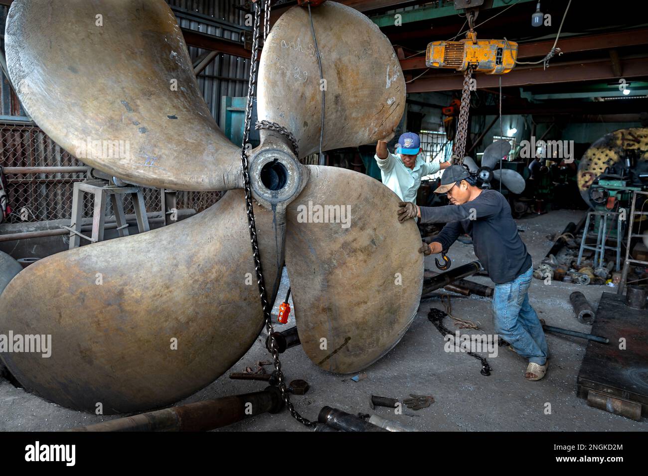 Workers repair propellers for fishing boats in Rach Gia City, Kien ...