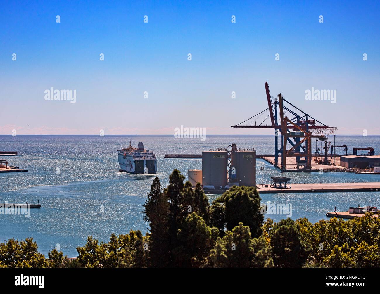 View from the Alcazaba (castle) of a ferry leaving Malaga City harbour ...