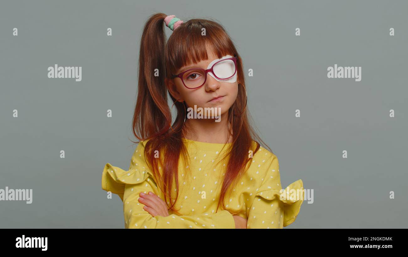 Sick ill preteen girl looking at camera having protective bandage ...