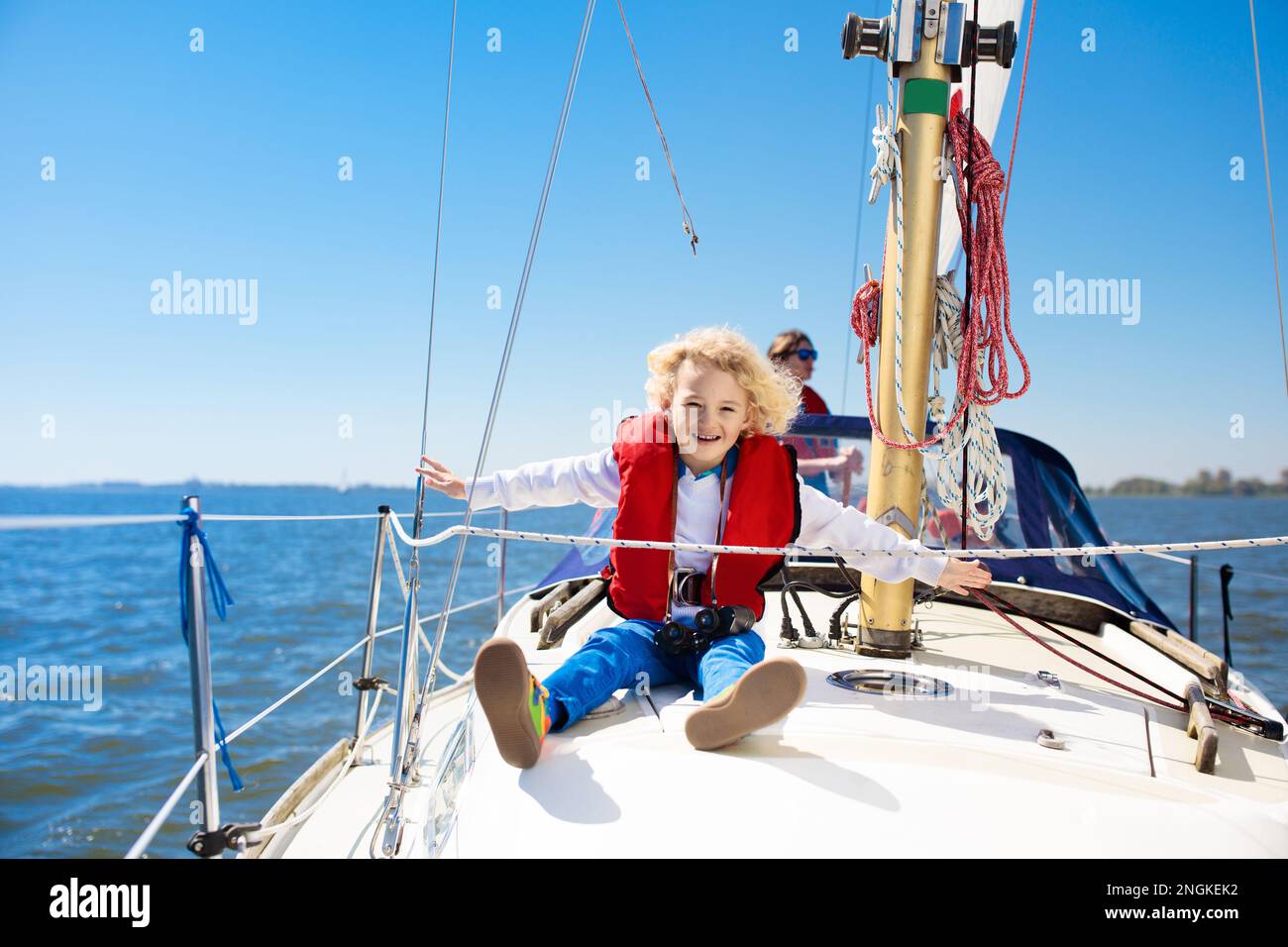Kids sail on yacht in sea. Child sailing on boat. Little boy in safe ...