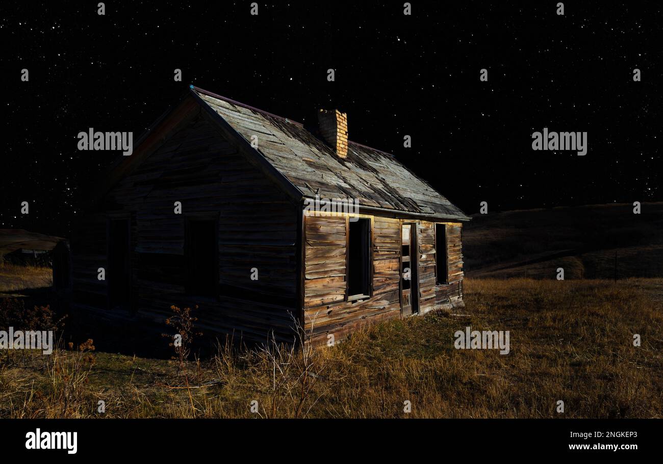 old and abandoned settlers home with stars that are shining above Stock ...