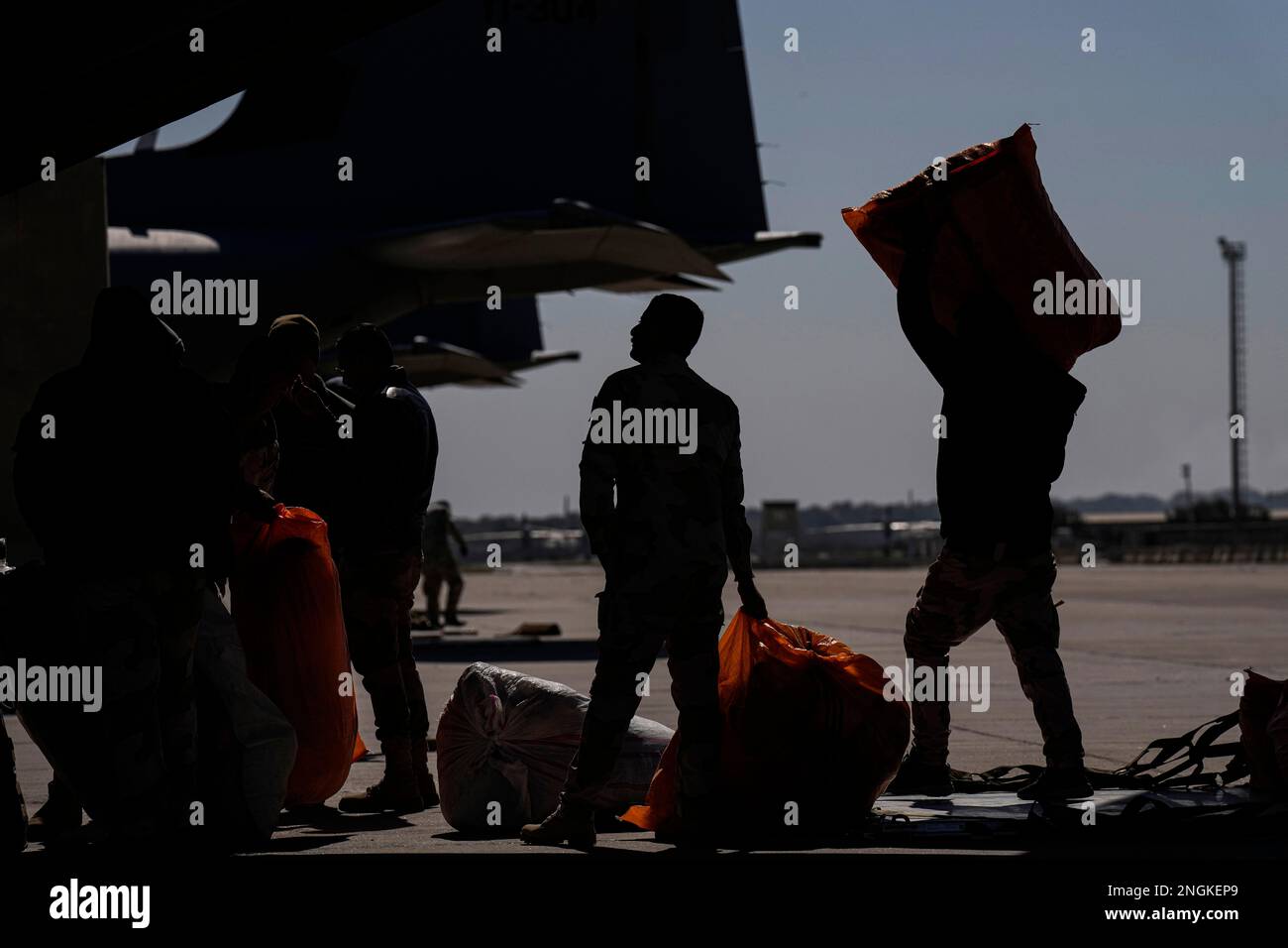 Iraqi security forces prepare humanitarian aid that will be shipped on ...