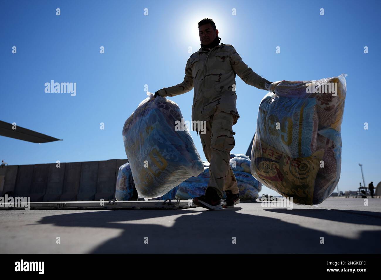 Iraqi security forces prepare humanitarian aid that will be shipped on ...
