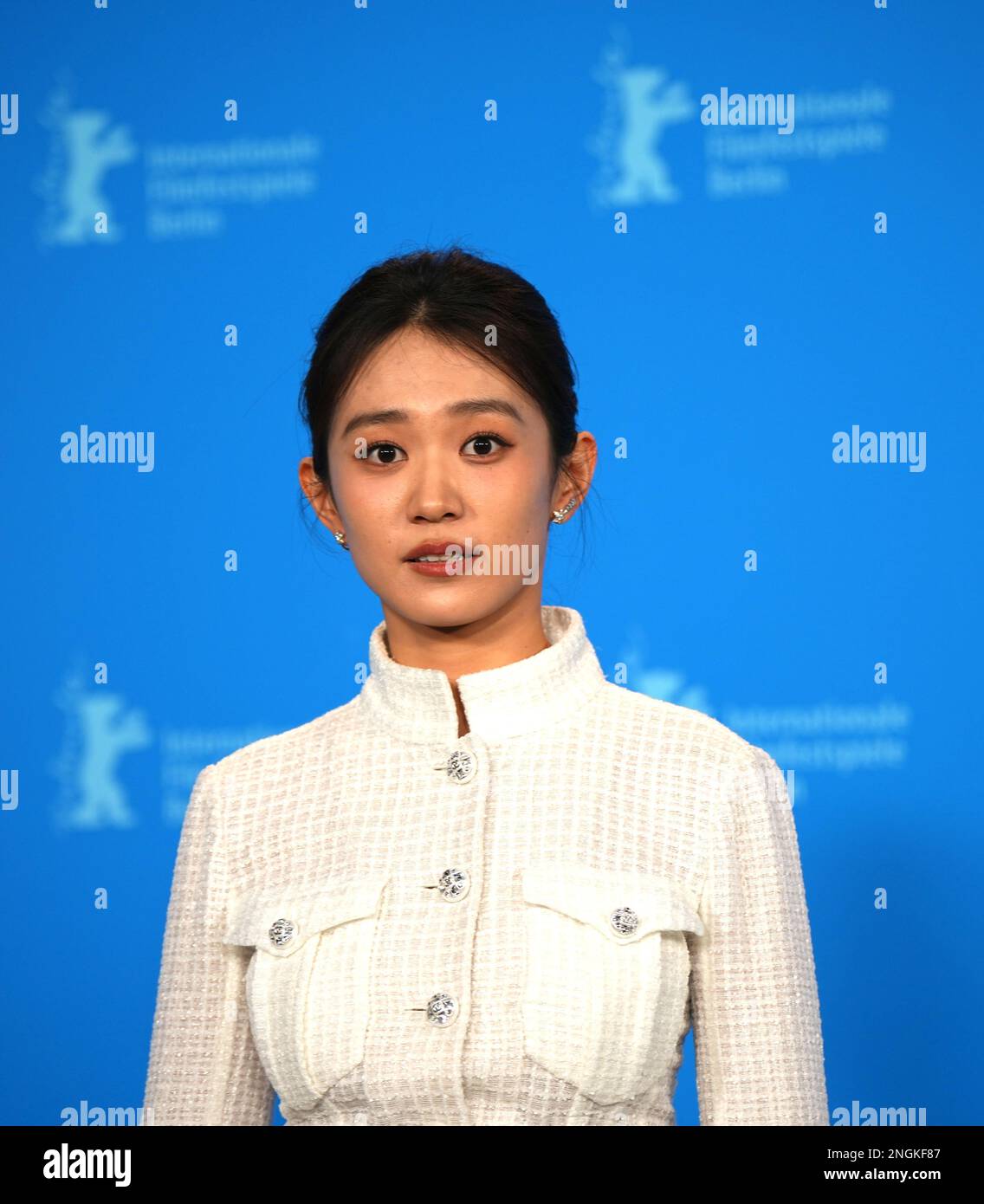 Berlin, Germany. 18th Feb, 2023. Actress Huang Yao stands in front of the blue wall during the ...