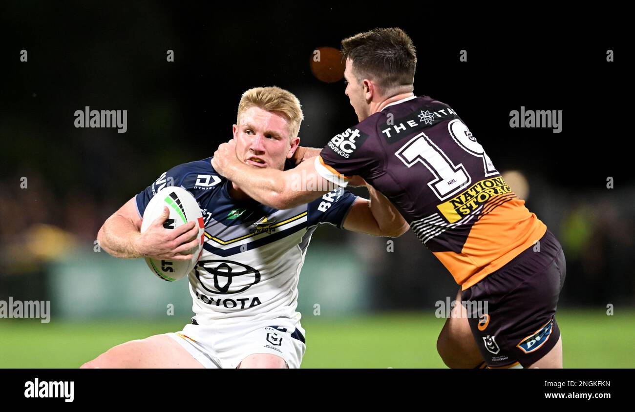 Tom Dearden (left) of the Cowboys is tackled by Jock Madden (right) of ...