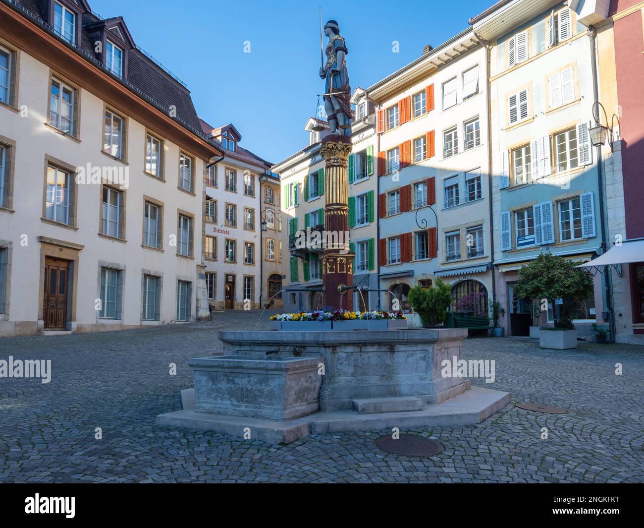 Biel, Switzerland - April 16th 2022: Historic buildings and a fountain ...