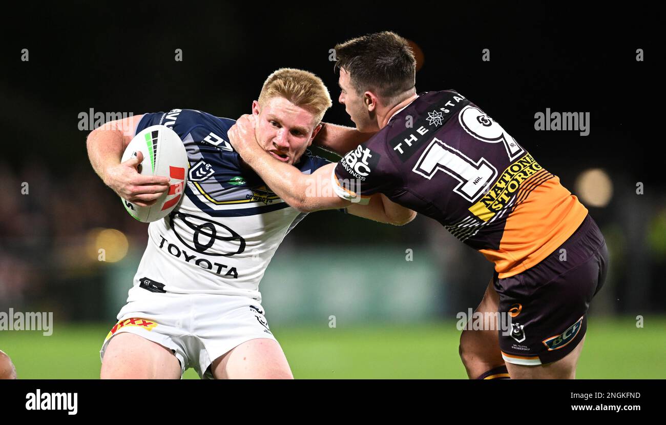Tom Dearden (left) of the Cowboys is tackled by Jock Madden (right) of ...
