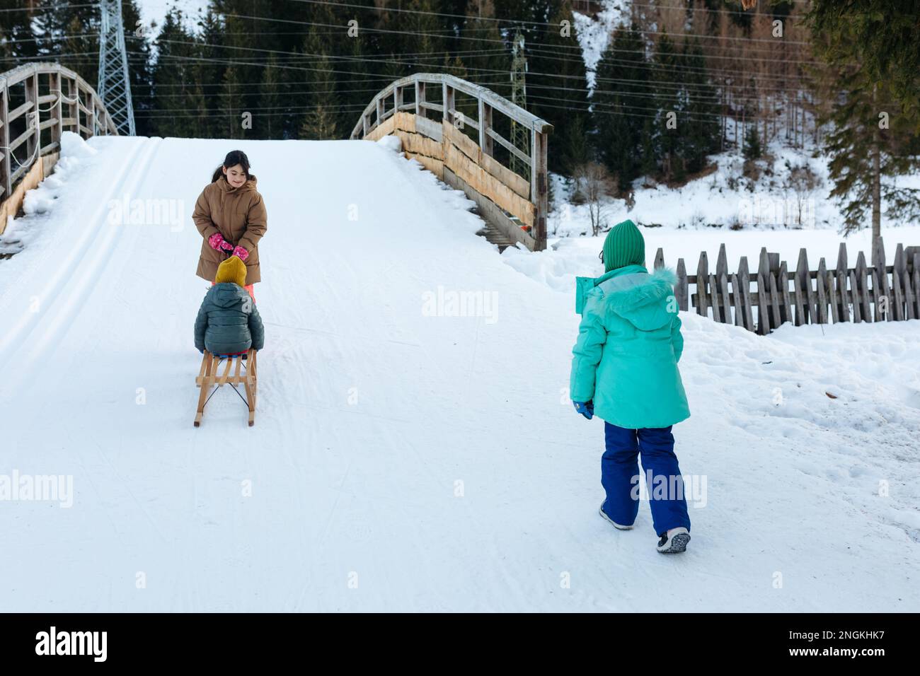 Three children playing on hill hi-res stock photography and images - Alamy