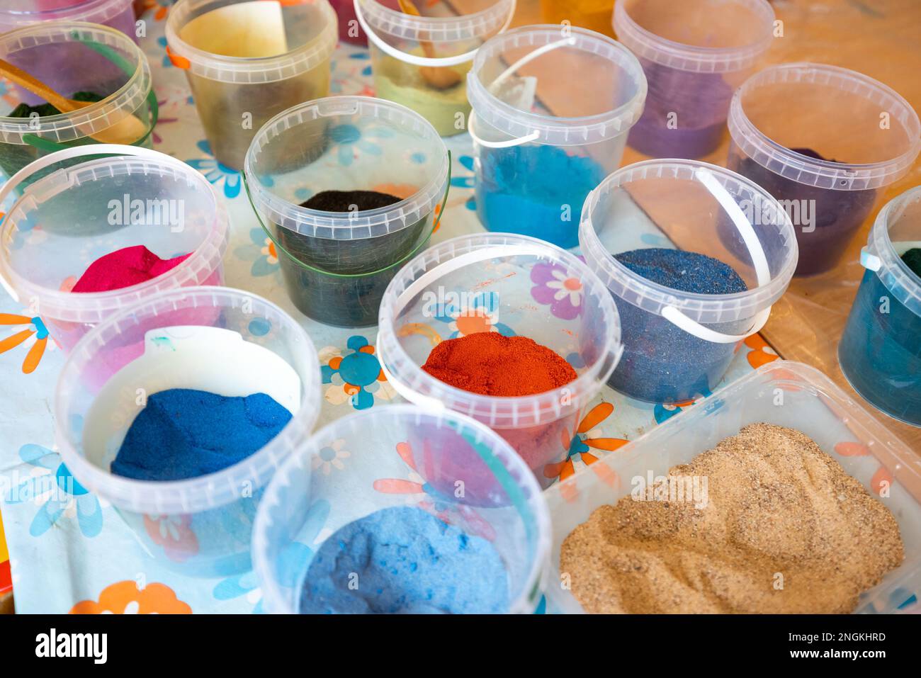 Colored sand in plastic containers, perfect for art and crafts Stock ...