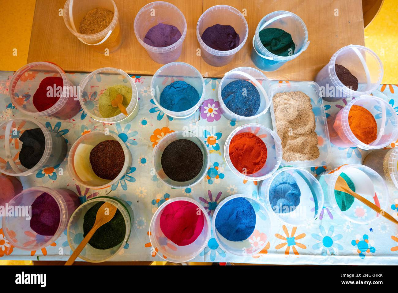 Colored sand in plastic containers, perfect for art and crafts Stock ...