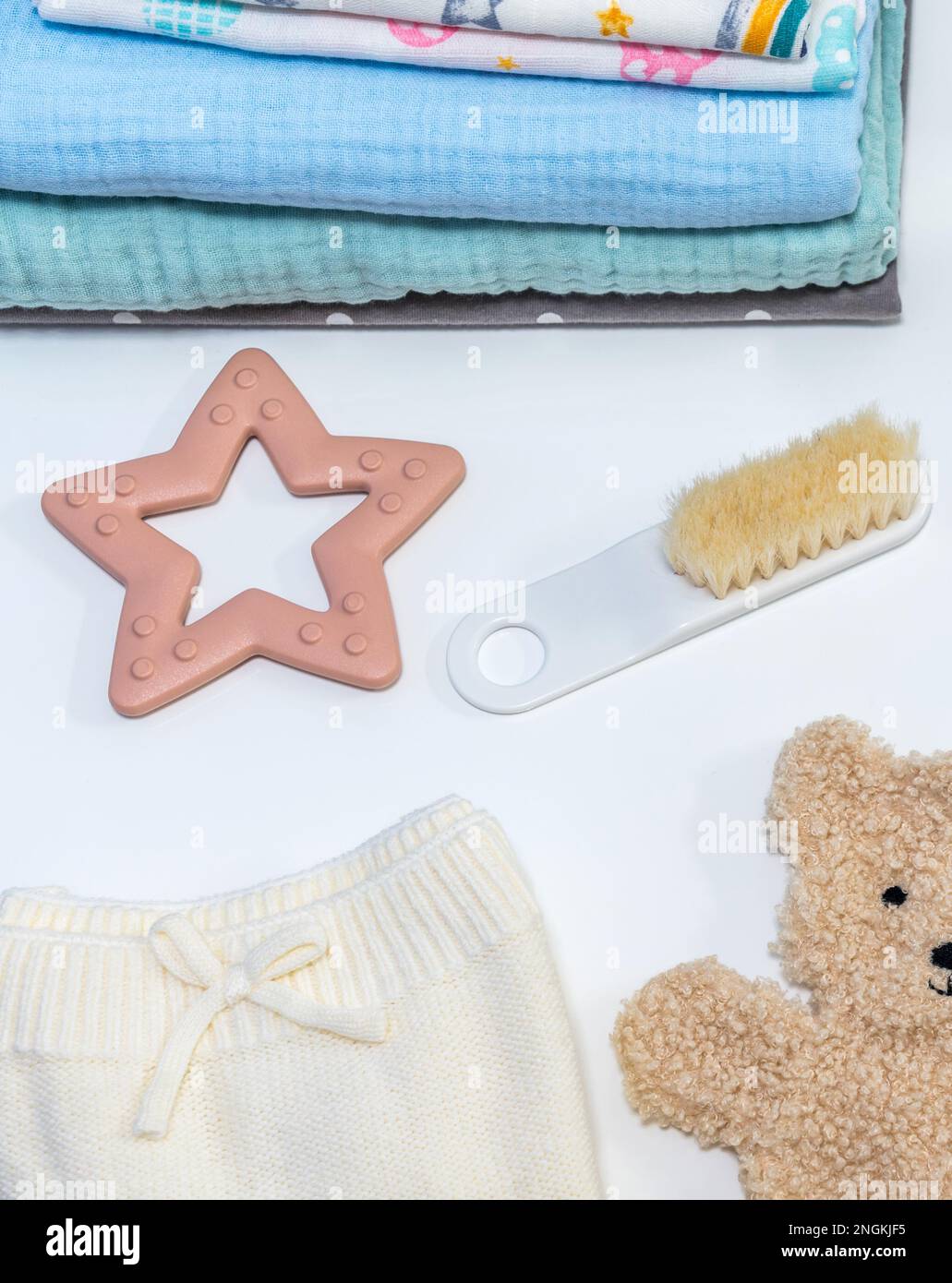 A few cute baby things on a white background as a concept of preparing ...