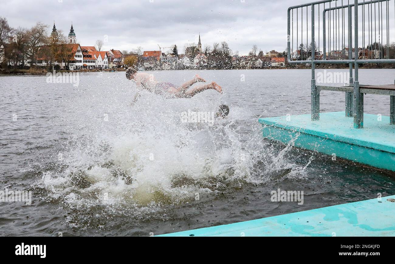 Bad Waldsee, Germany. 18th Feb, 2023. Several men jump into the city ...