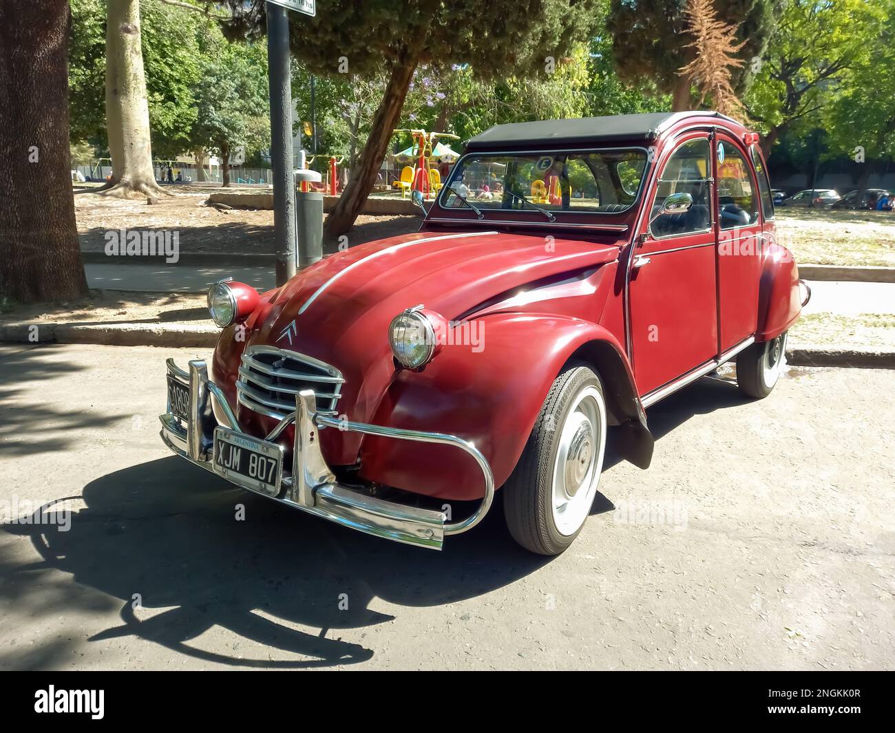 old red burgundy popular Citroen 3CV 1960-1979 in the street in front ...