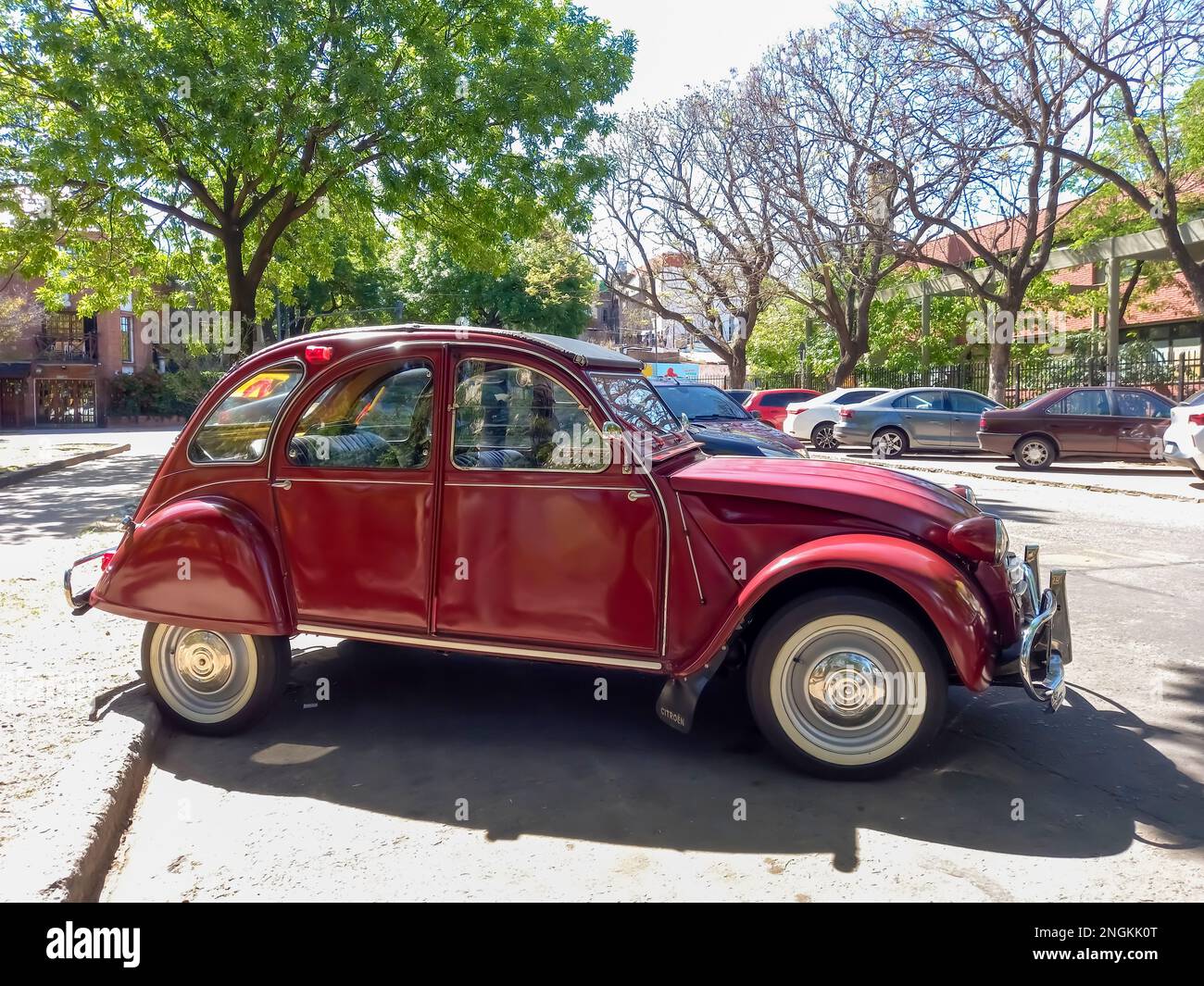 old red burgundy popular Citroen 3CV 1960-1979 in the street in front ...