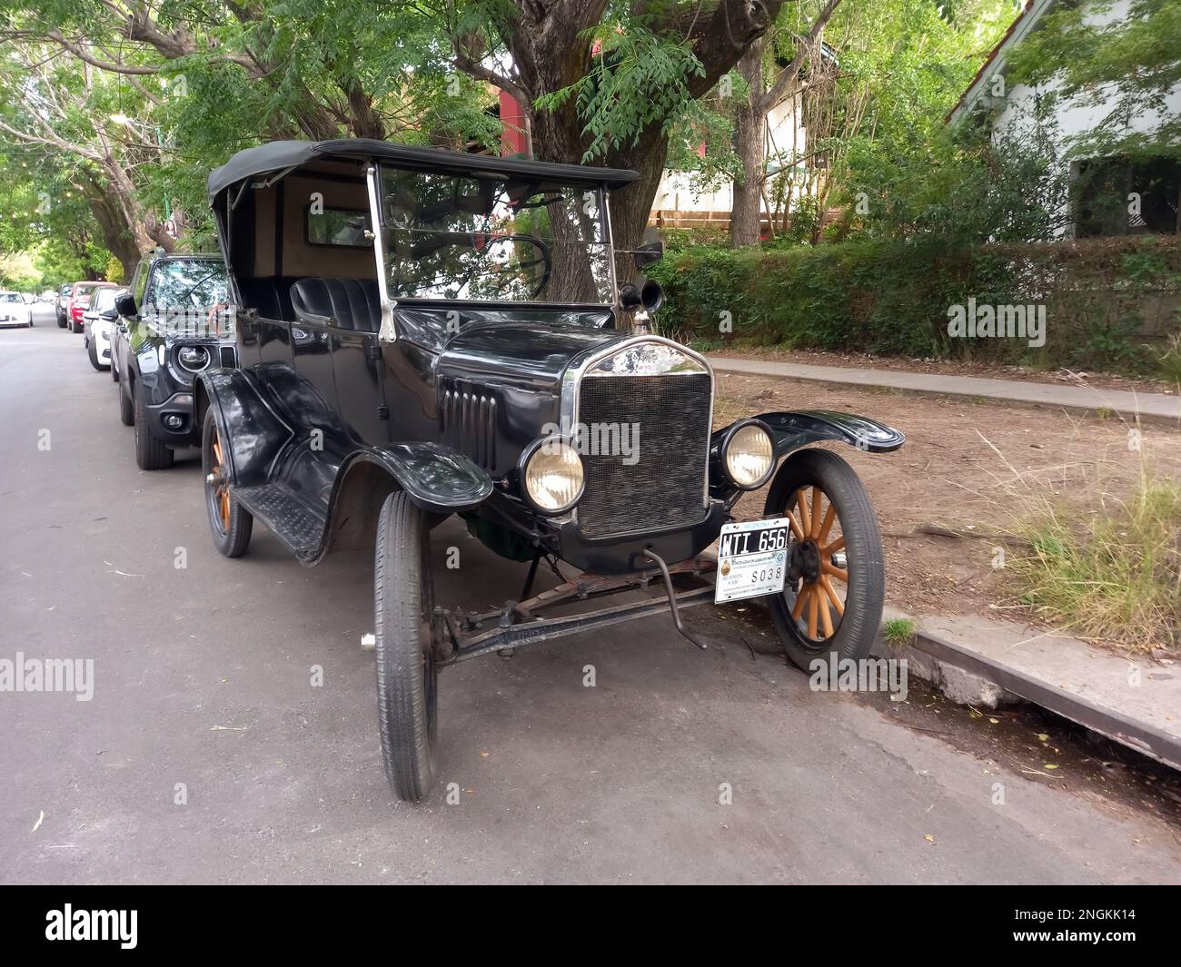 Shot of a vintage car black 1920s Ford Model T double phaeton parked in ...