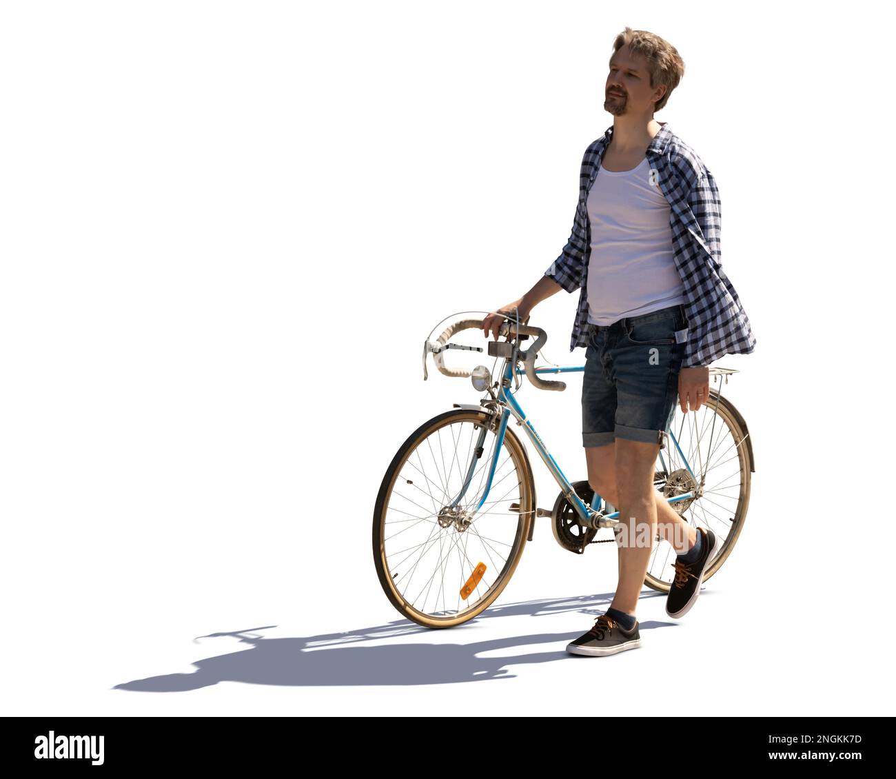 Backlit man with a bike walking on the street isolated on white ...