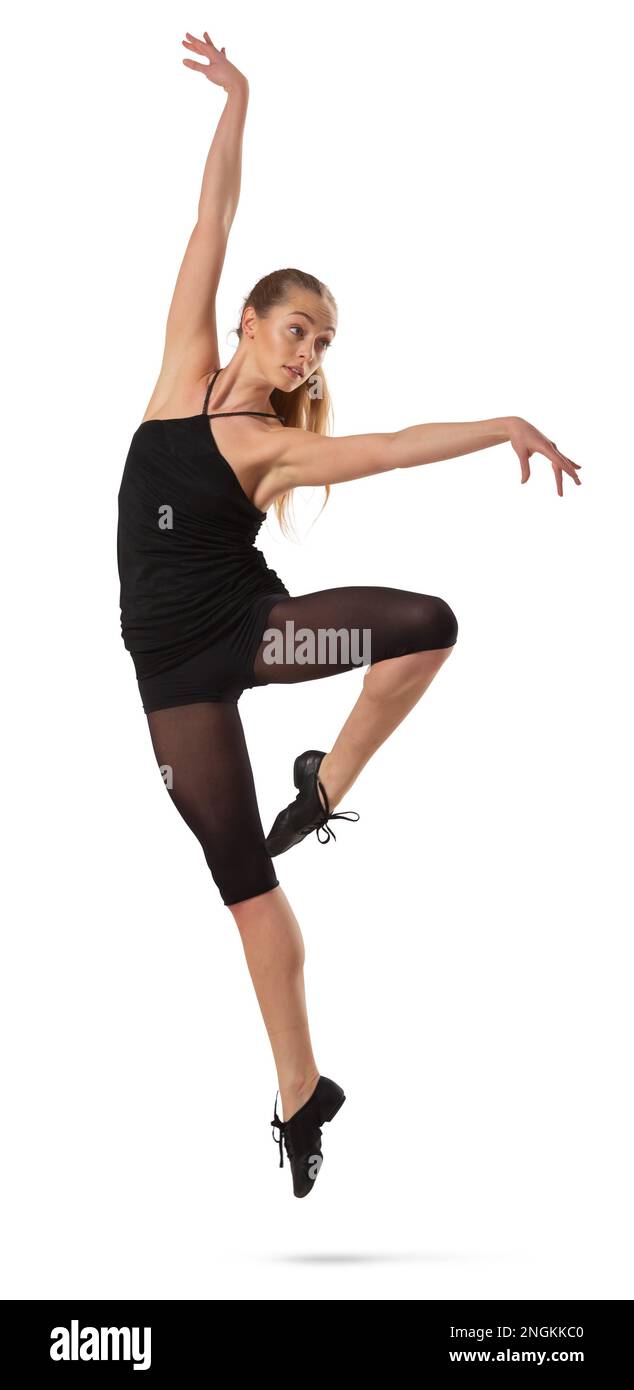 Young female dancer jumping gracefully up in the air isolated on white ...