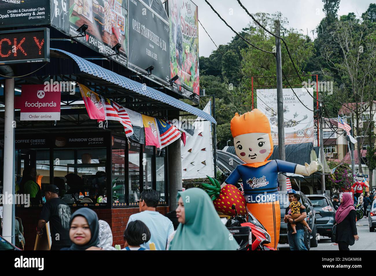 Floating a the Opah Strawberry restaurants welcoming tourists. Cameron ...