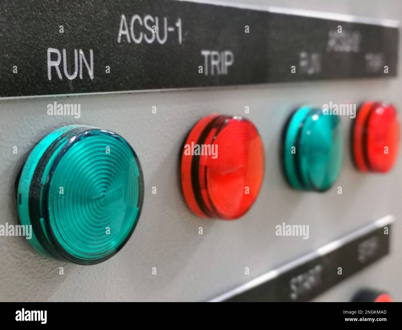 Close up view a row of led pilot lamps with tags mounted on electrical ...