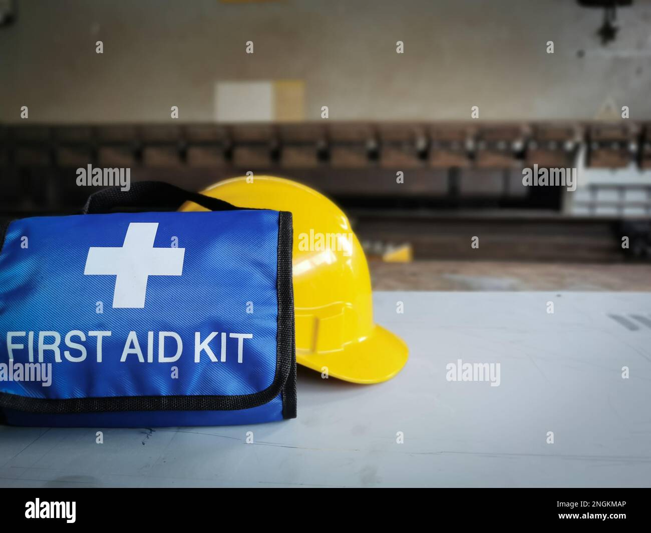 first aid kit bag with safety helmet in the factory Stock Photo - Alamy