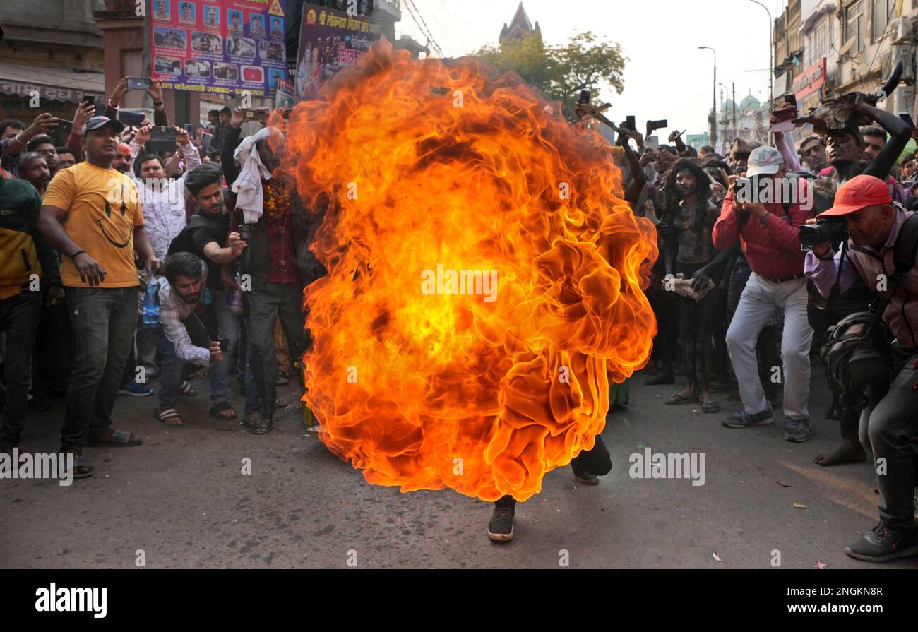 An Indian Hindu devotee demonstrates his fire breathing skills during a ...
