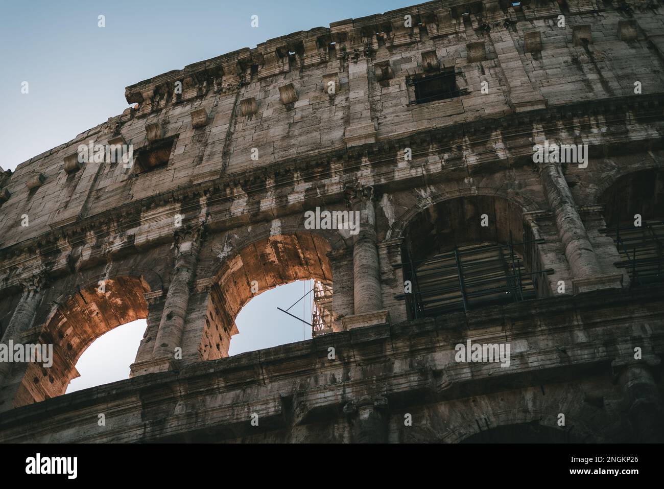 The iconic Colosseum stands tall, reflecting the ancient Roman ...