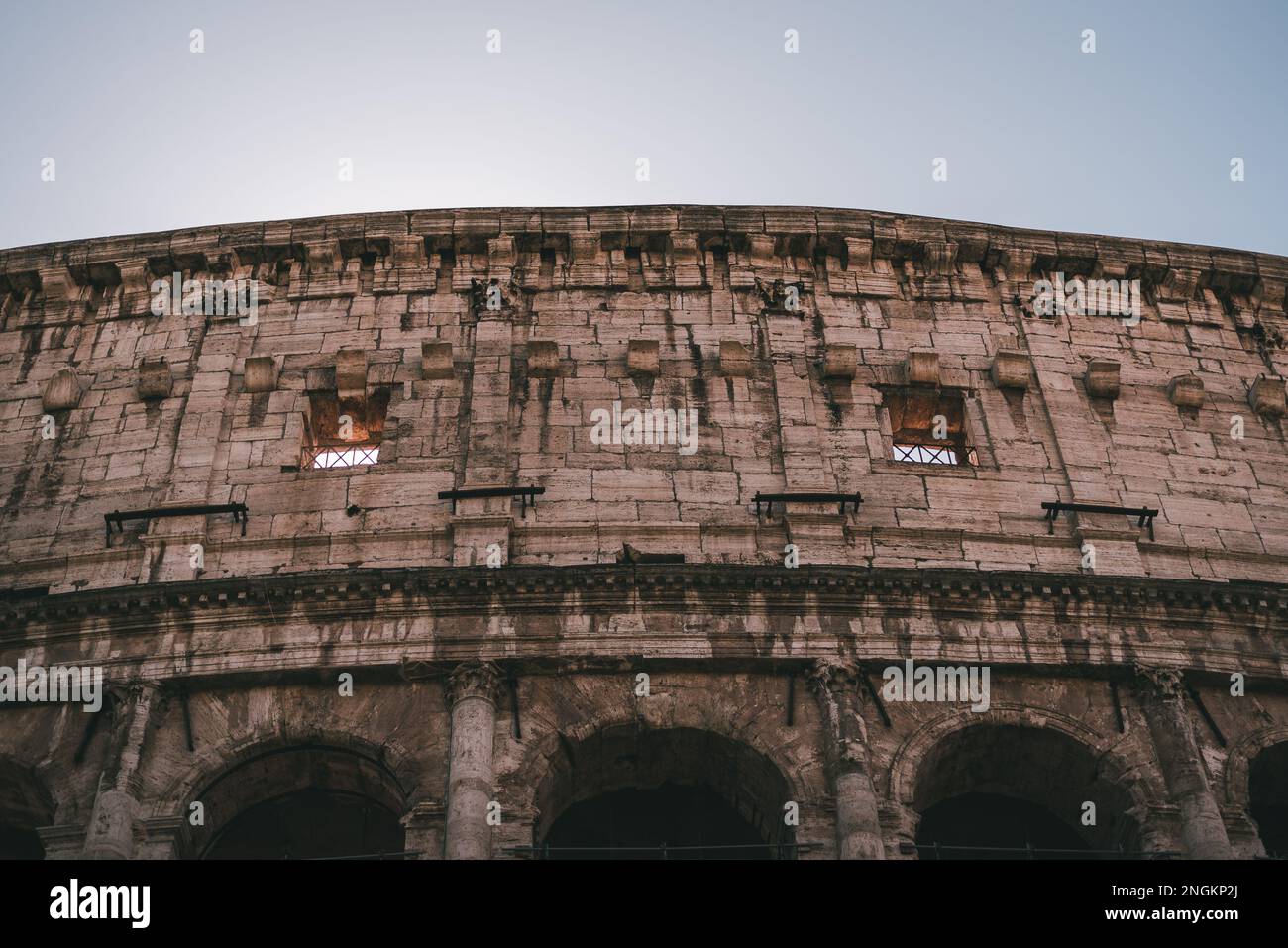 The iconic Colosseum stands tall, reflecting the ancient Roman ...