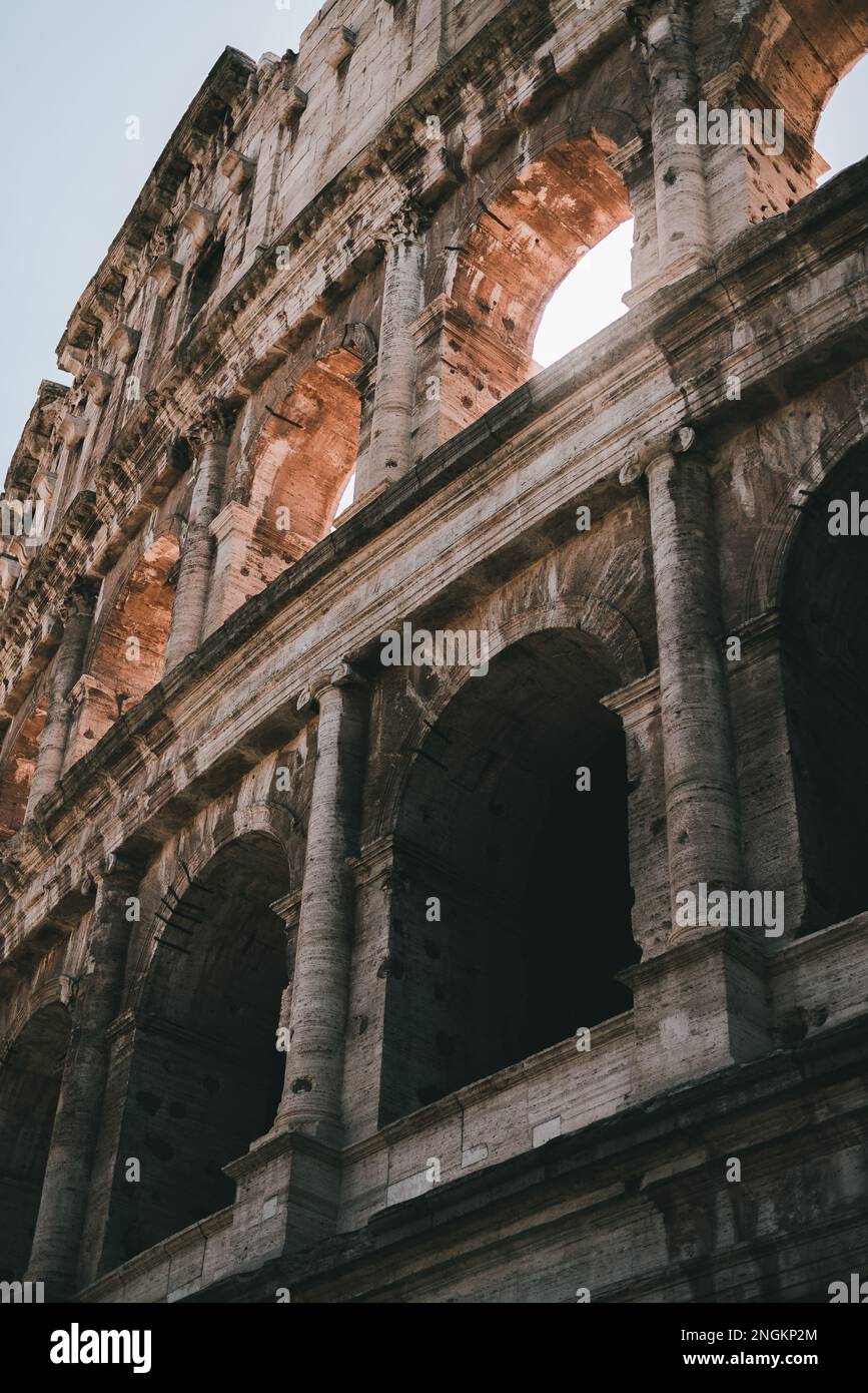 The iconic Colosseum stands tall, reflecting the ancient Roman ...
