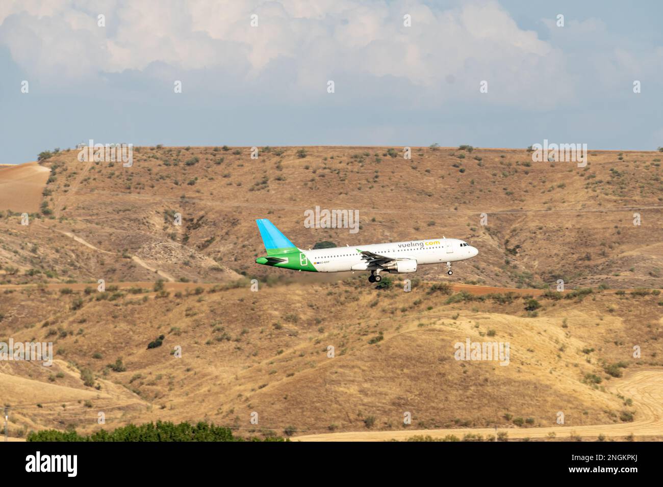 White, green and blue Airbus A320-216 of Vueling with registration EC ...