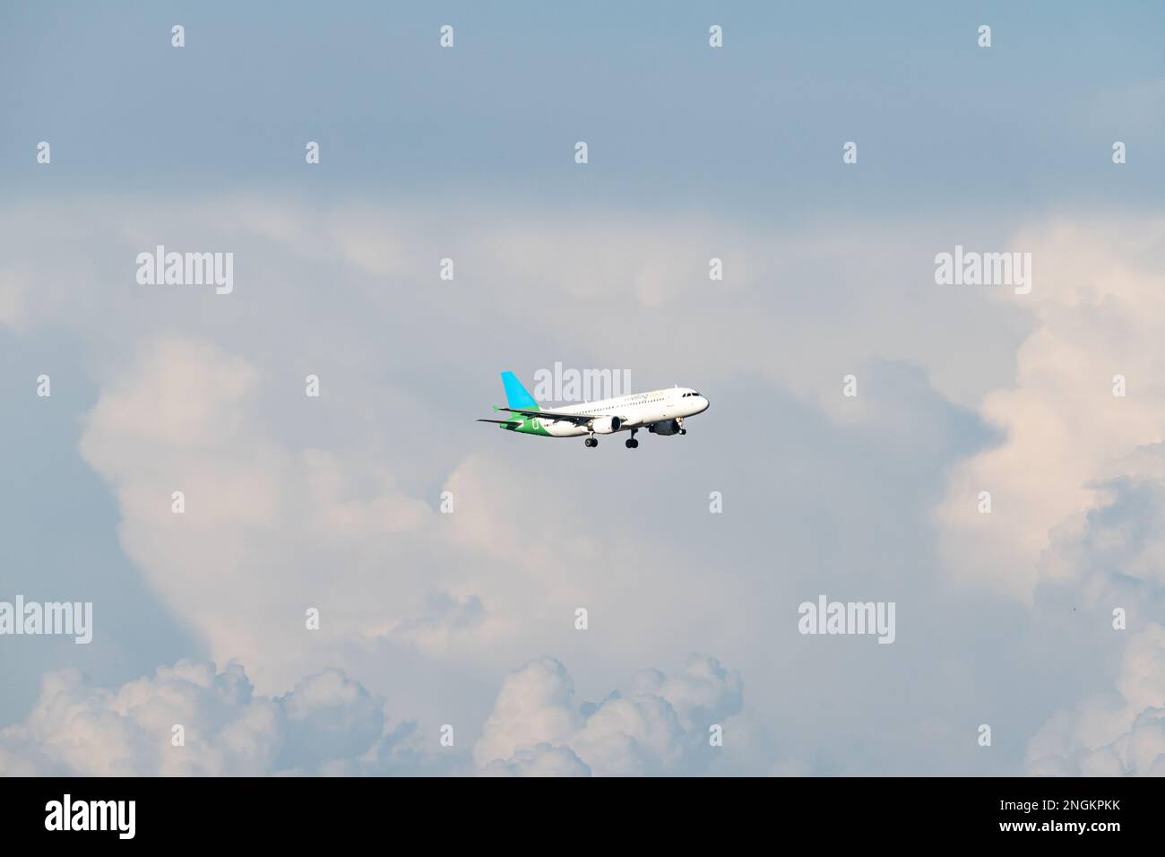 White, green and blue Airbus A320-216 of Vueling with registration EC ...