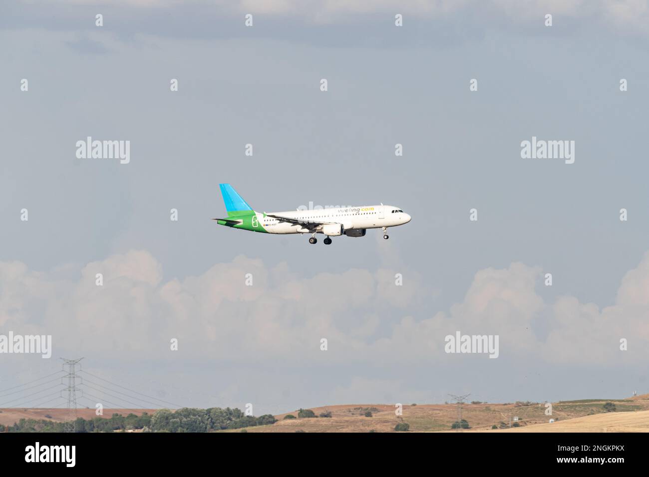 White, green and blue Airbus A320-216 of Vueling with registration EC ...