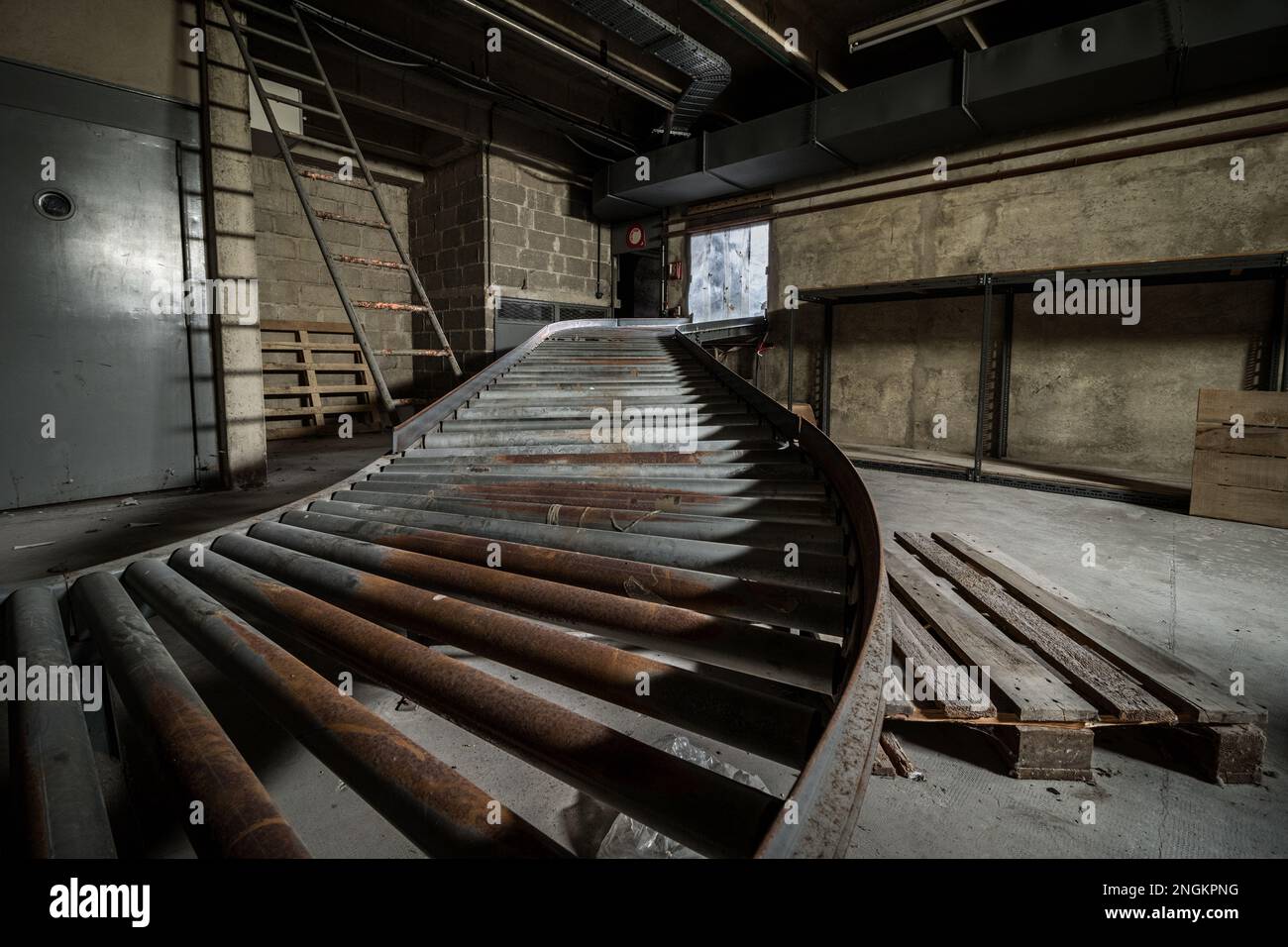 Roller conveyor belt for moving goods in an old abandoned factory ...
