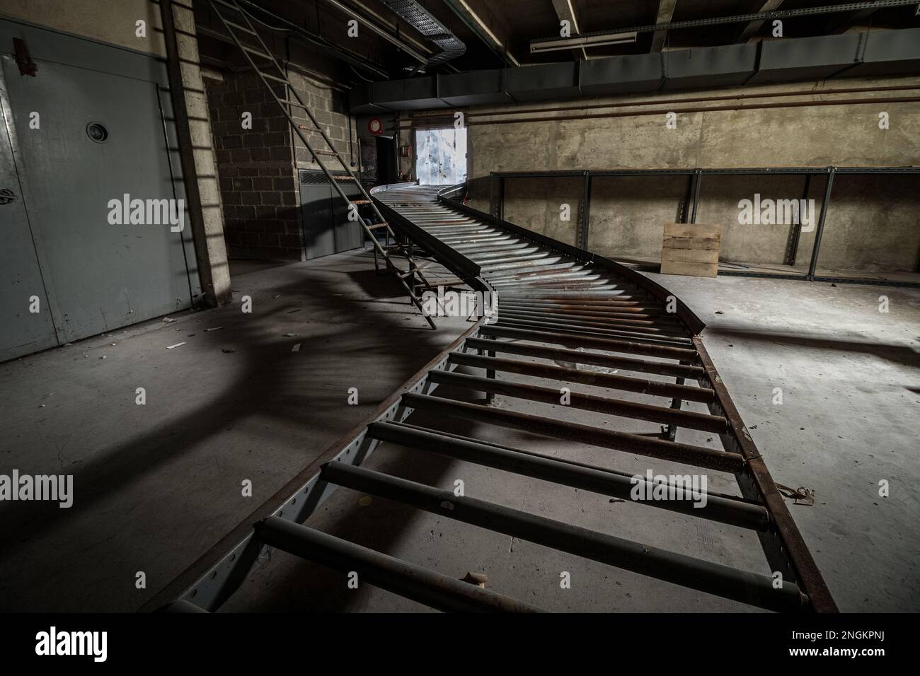 Roller conveyor belt for moving goods in an old abandoned factory ...