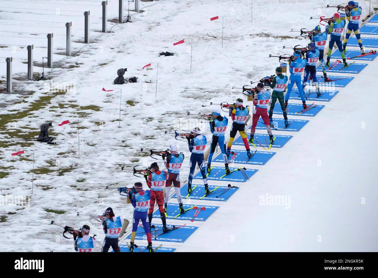 Athletes shoot in the Men's 4x7.5km Relay event at the Biathlon World ...