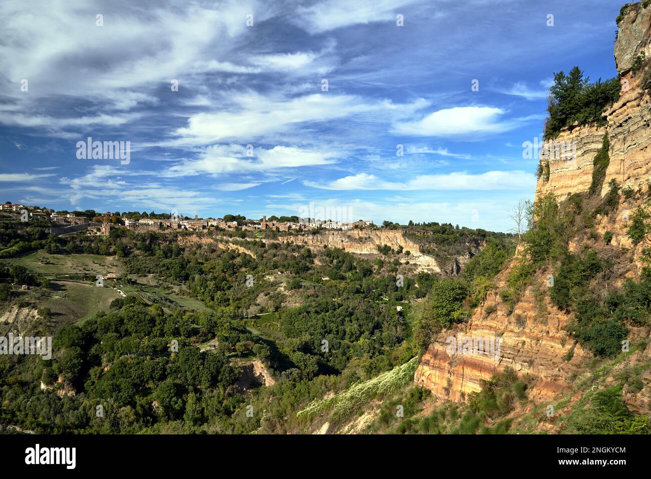 Rocky escarpment and historic buildings in Bagnoregio, Italy Stock ...