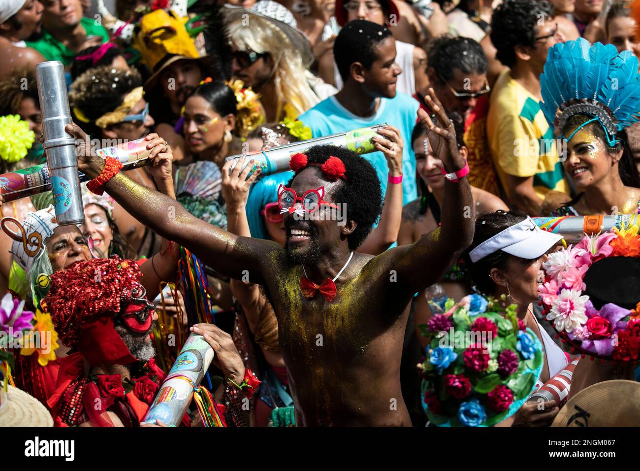 A musician dressed as a devil plays a rattle during the "Ceu na Terra ...
