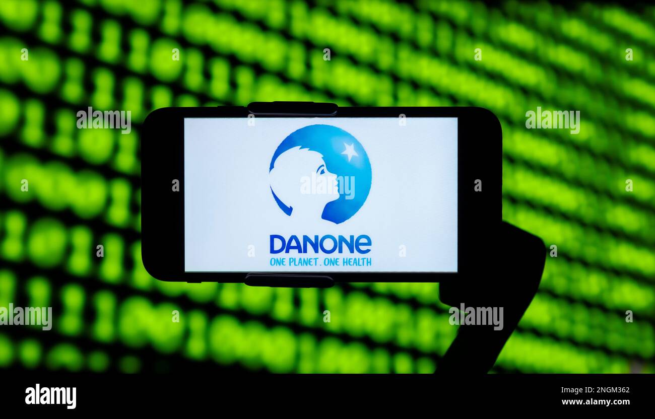 In this photo illustration, the logo of Danone seen displayed on a ...