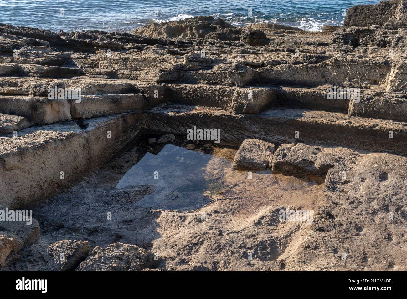 Old quarry of the Mallorcan mares stone, on the rocky coast of the ...