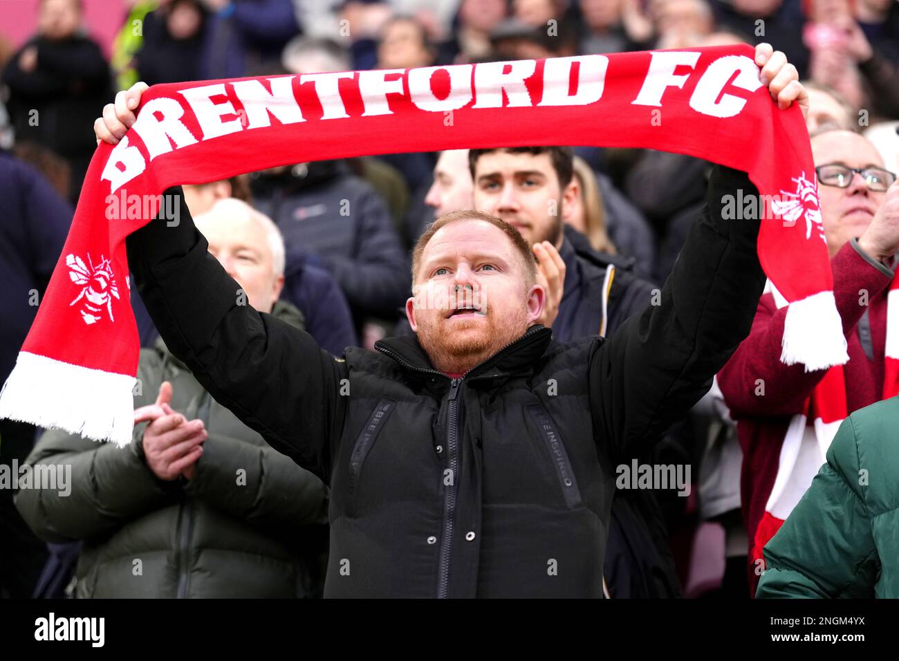 Brentford fans holds up scarves before the Premier League match at the ...