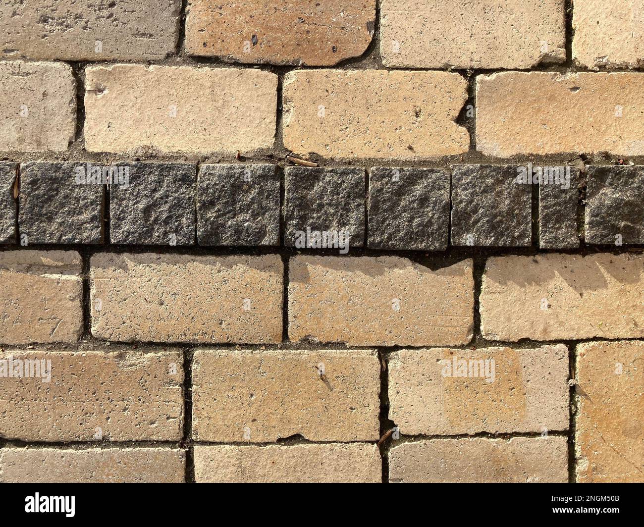 Yellow stone tiles masonry closeup background. the texture of yellow ...