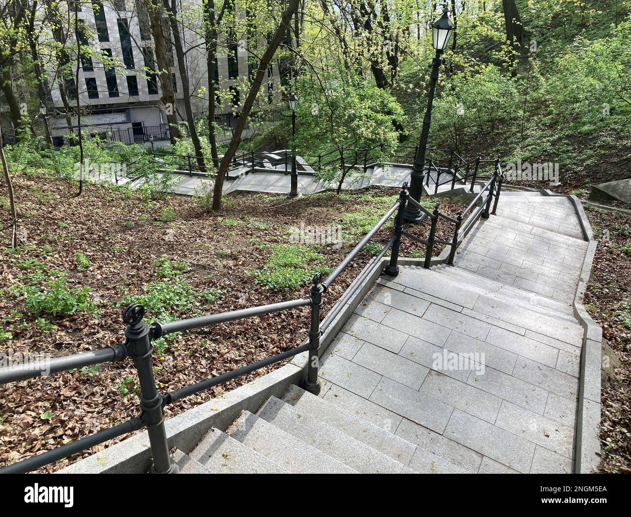 The staircase loops down the mountain. Gray granite steps in the city ...