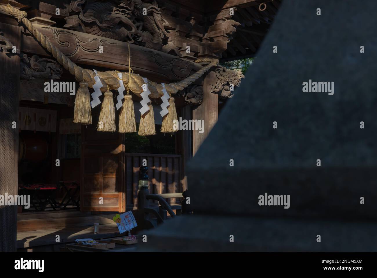 A sacred rope in front of the temple at Japanese Shrine Stock Photo - Alamy