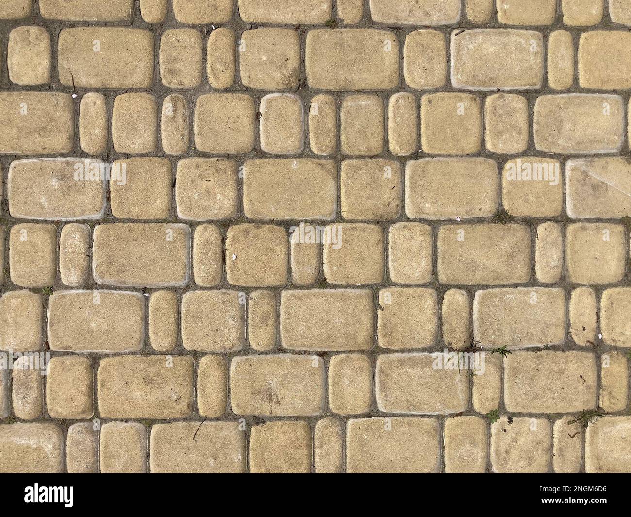 Yellow stone tiles masonry closeup background. the texture of yellow ...