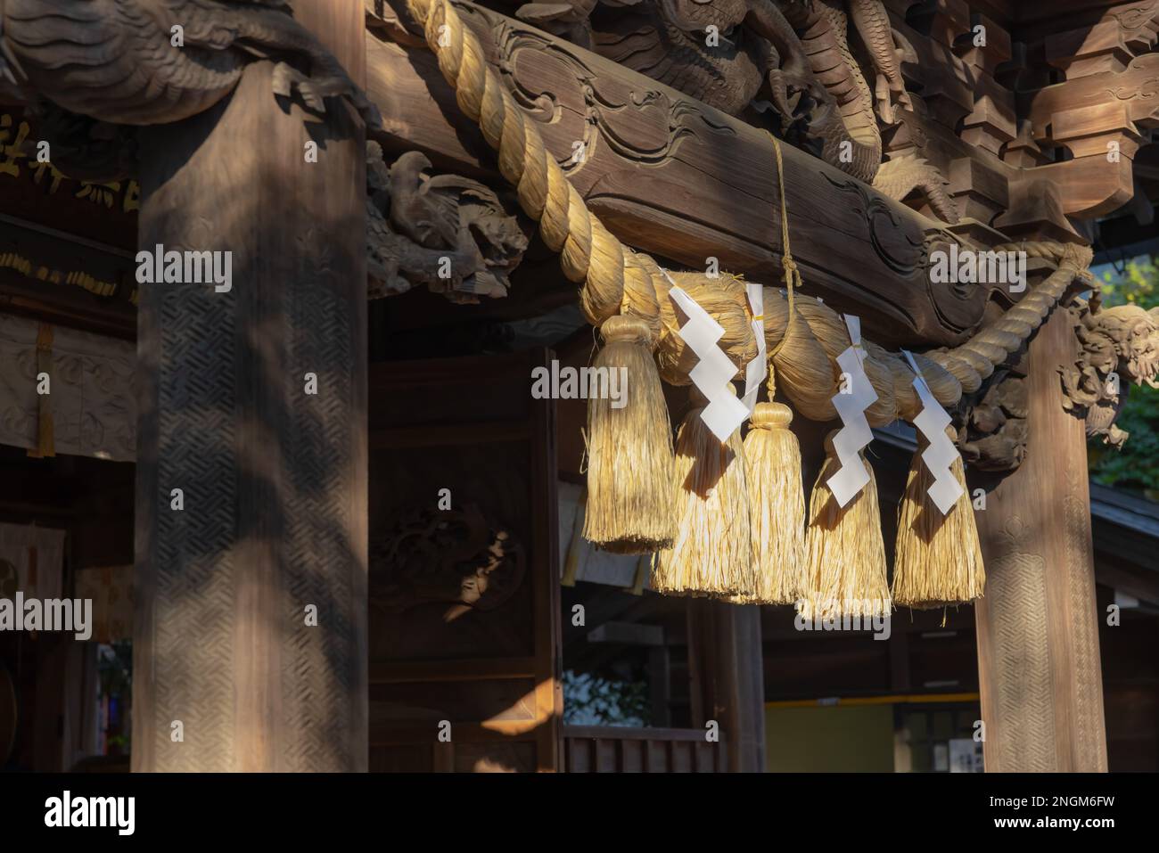 A sacred rope in front of the temple at Japanese Shrine Stock Photo - Alamy