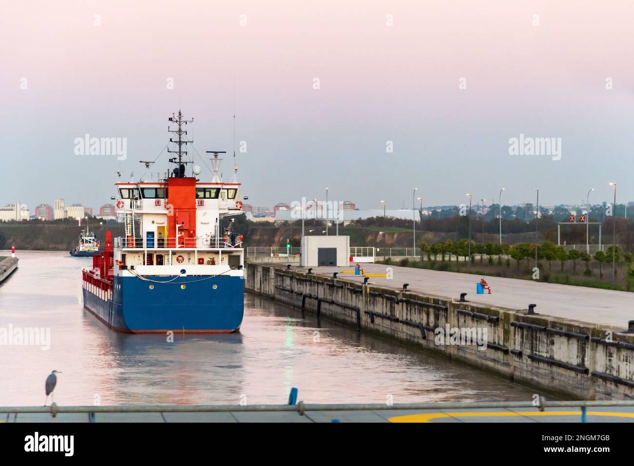 Merchant ship entering the river port of Seville from the lock Stock ...